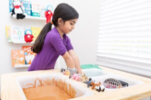Muddy Oobleck Sensory Table With Animals - Fun with Mama